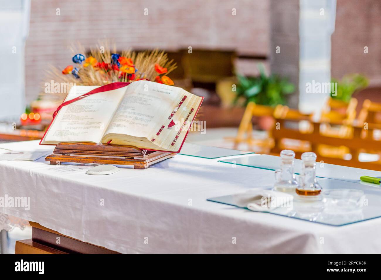 Open Bible on the altar of Catholic Church Stock Photo - Alamy
