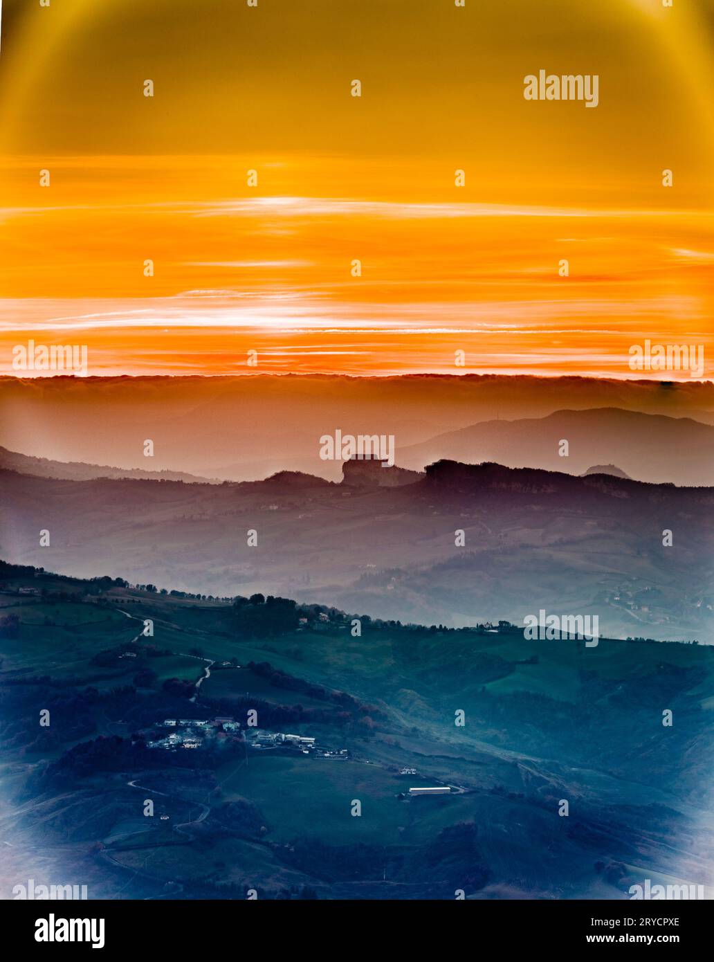 Sunset on hilly countryside in winter Stock Photo - Alamy