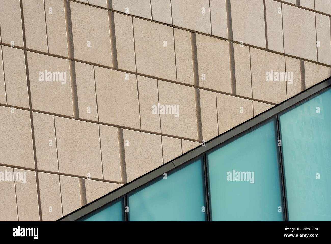 glass and sandstone modern building, close up exterior architecture ...