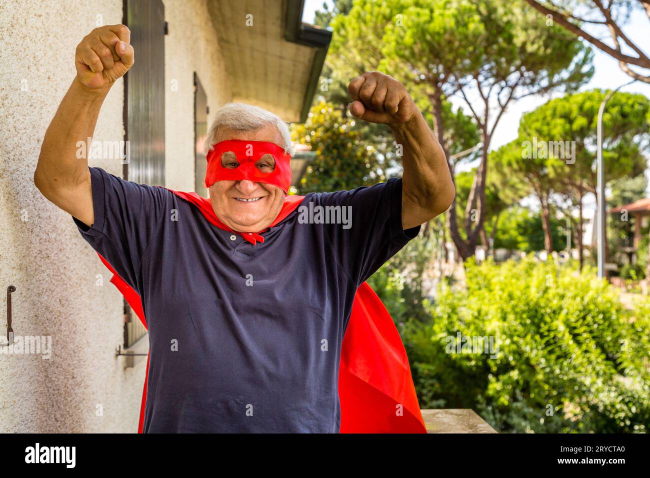 Old man dressed as a superhero Stock Photo - Alamy
