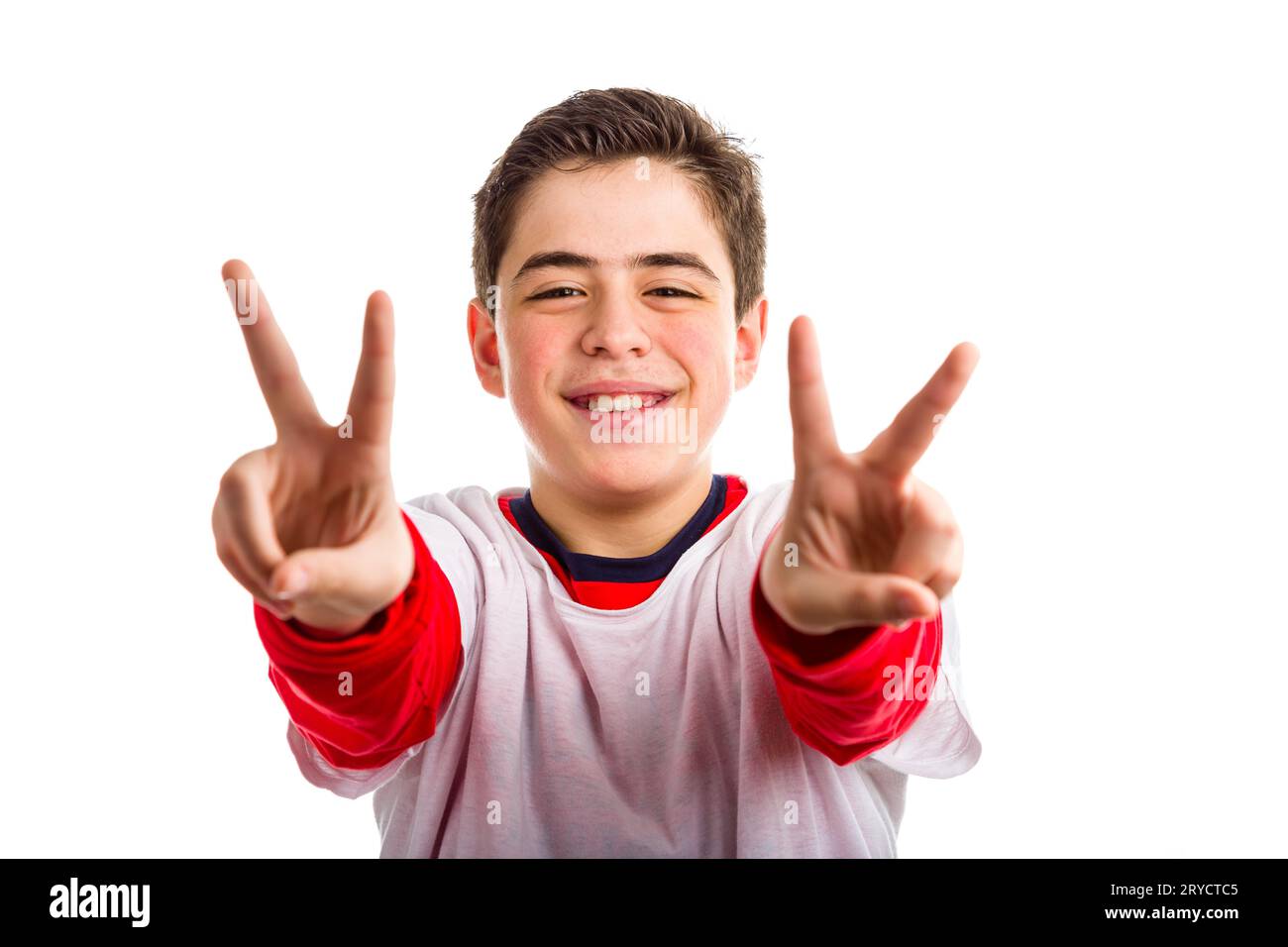 Caucasian boy making victory sign with both hands Stock Photo - Alamy