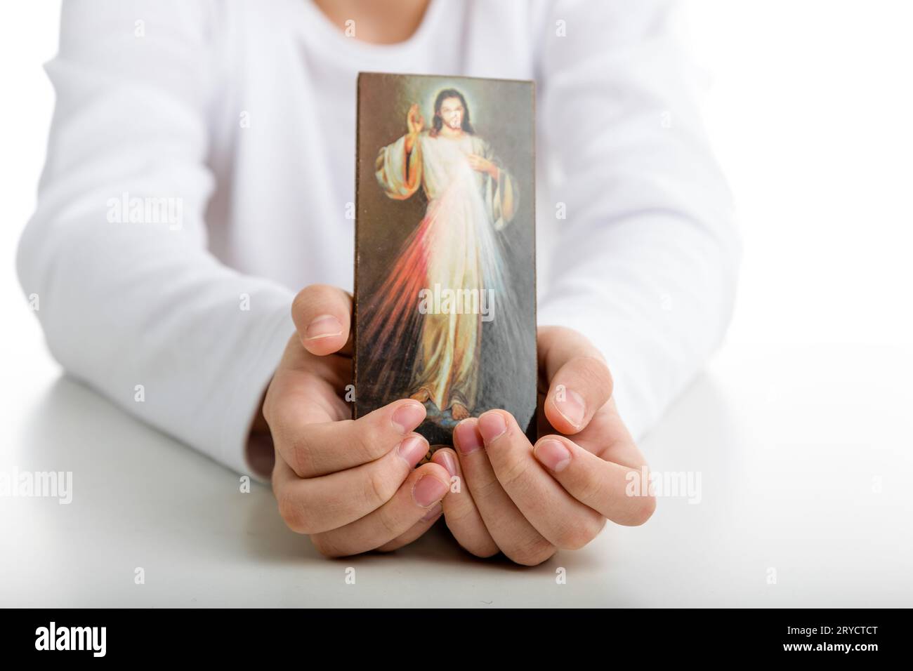 Caucasian boy showing Merciful Jesus icon Stock Photo - Alamy