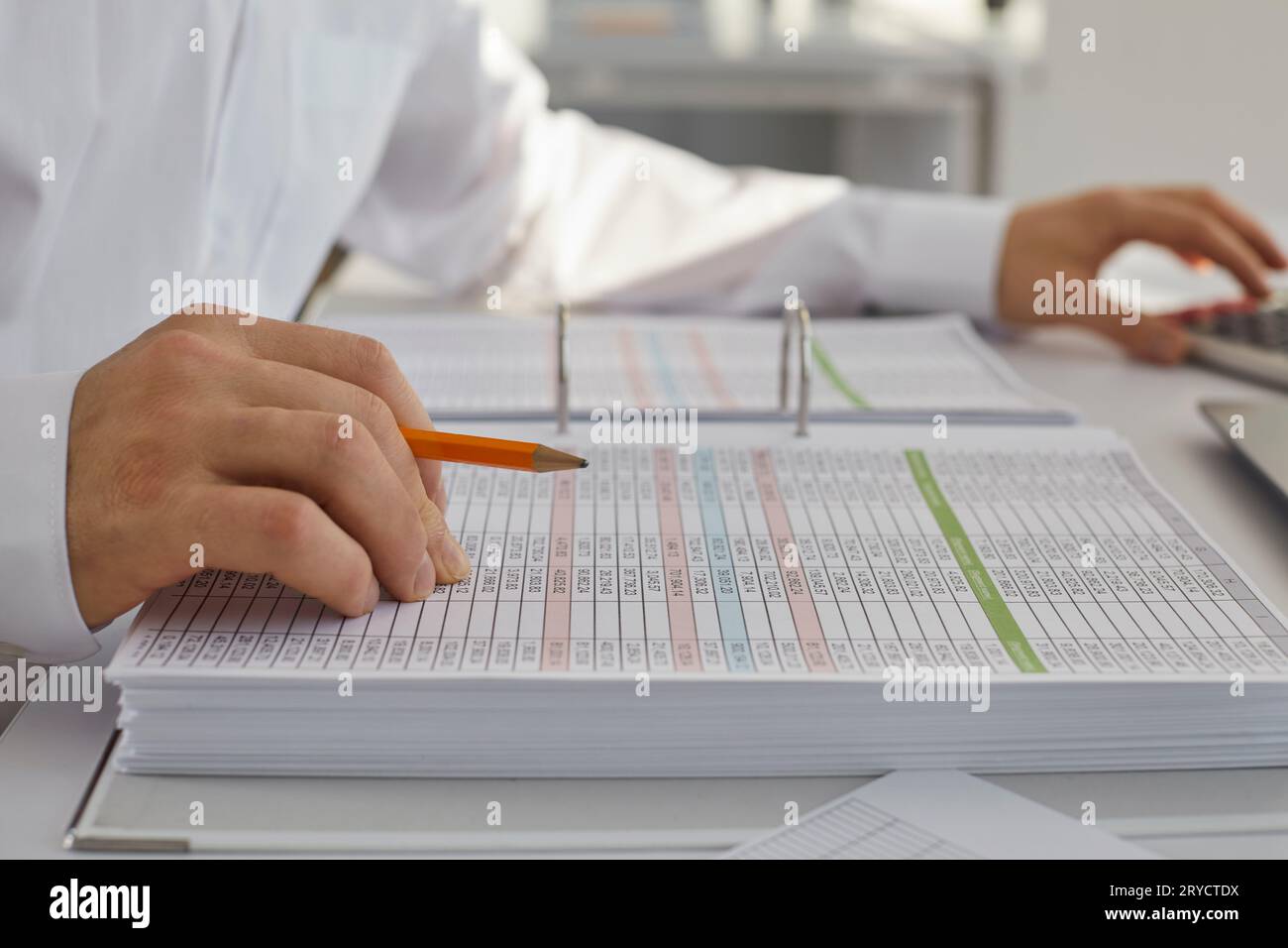 Busines person working with spreadsheet document at office desk Stock ...