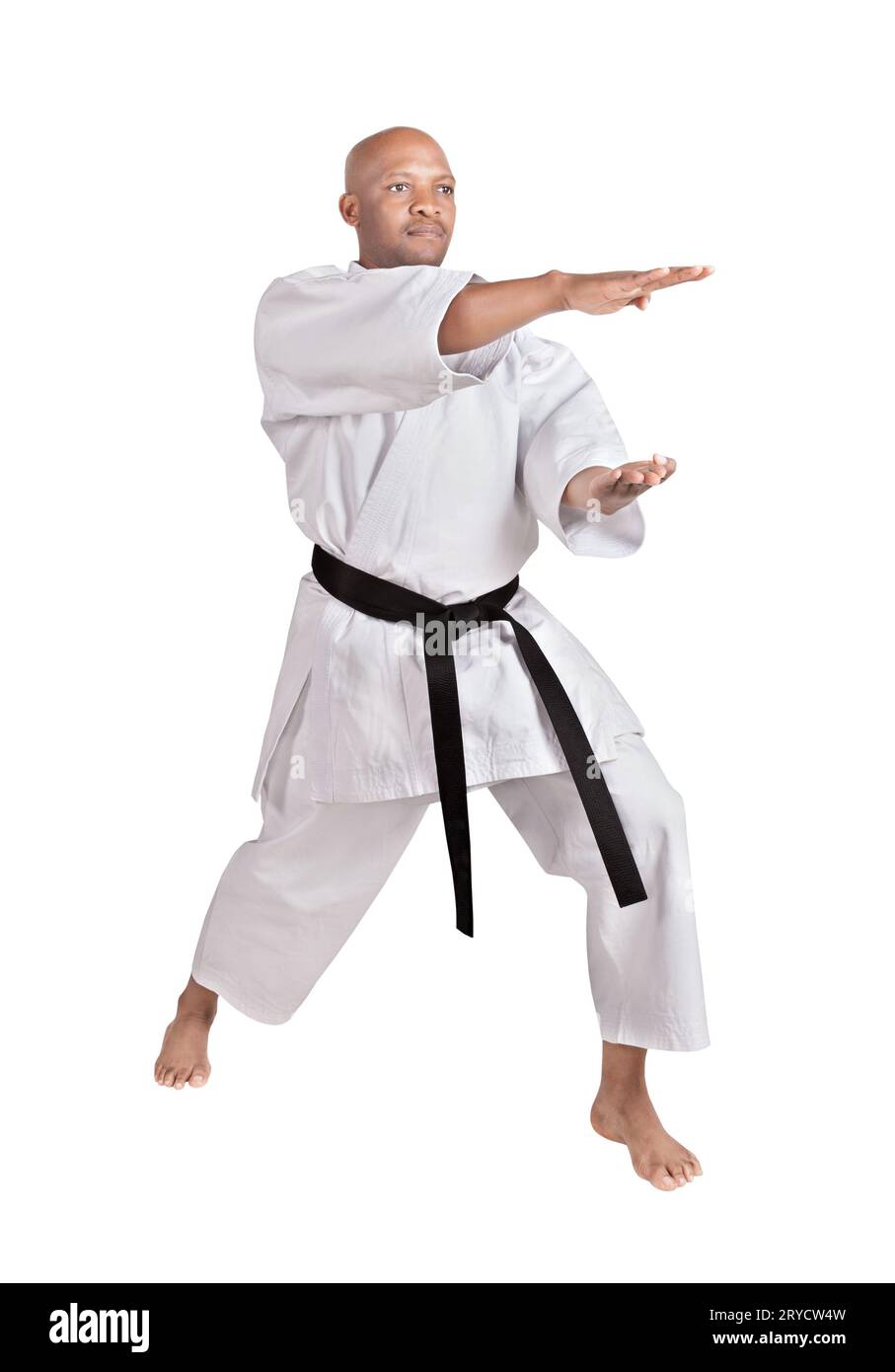 african american karate man in a kumite stance, exercising his kata, in ...