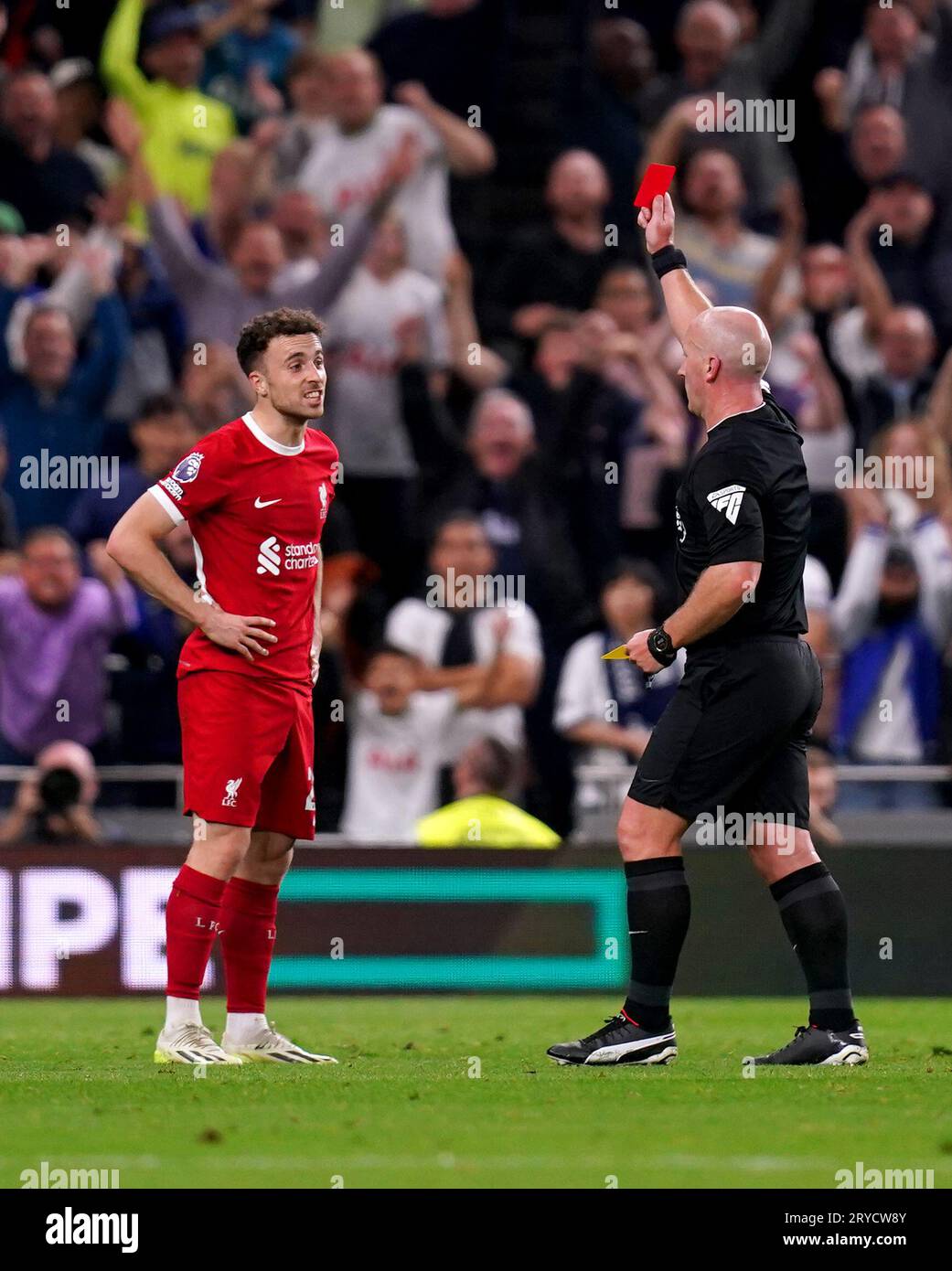 Liverpool's Diogo Jota is shown a red card after his second foul on ...