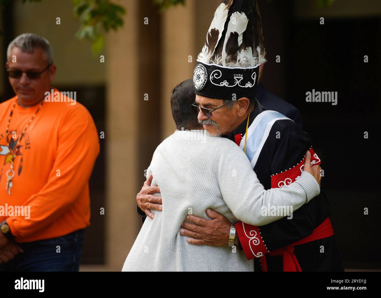 Keptin James Bernard hugs elder Marlene Thomas, a residential school ...