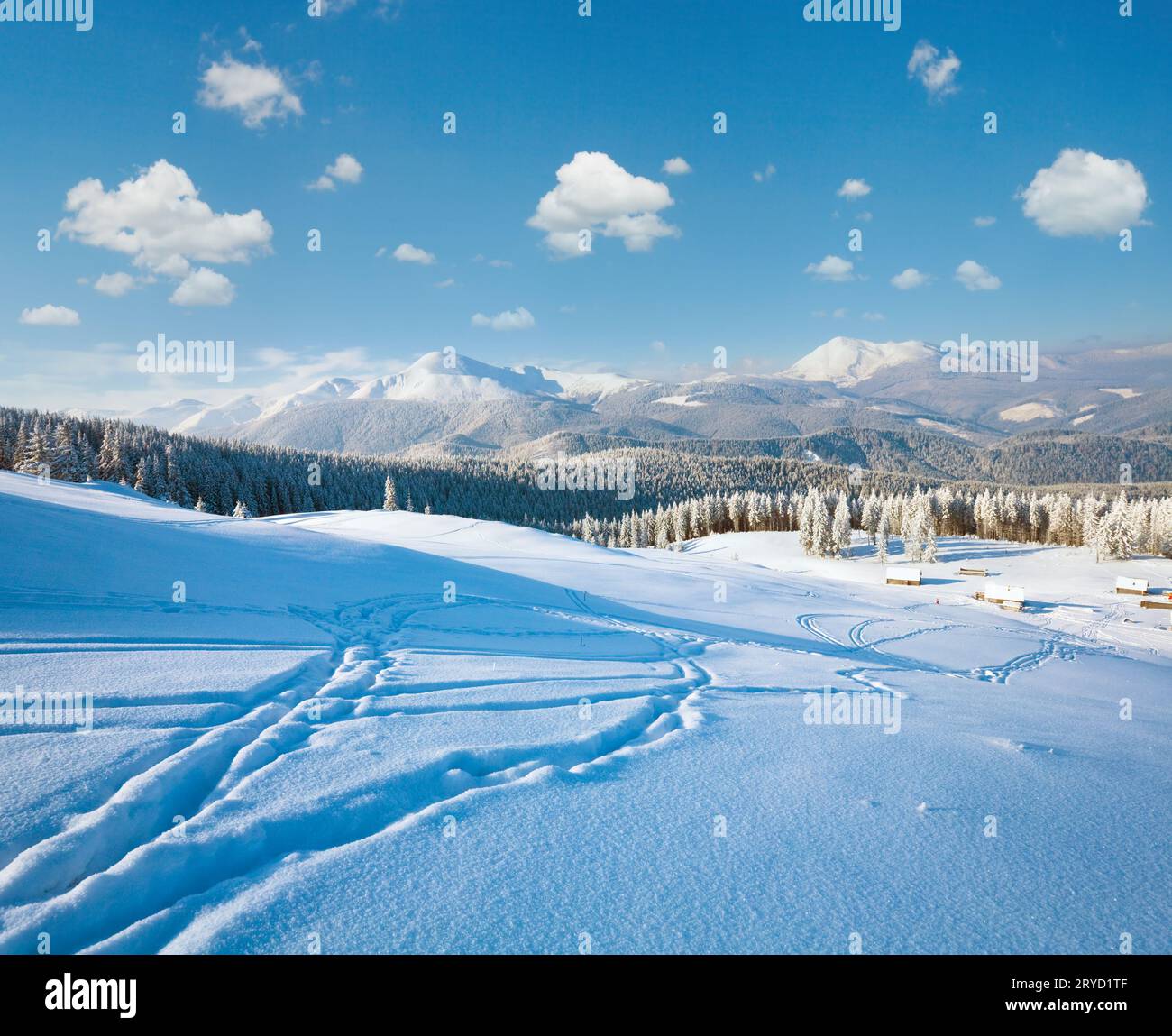 Winter calm mountain landscape with sheds group and mount ridge behind ...