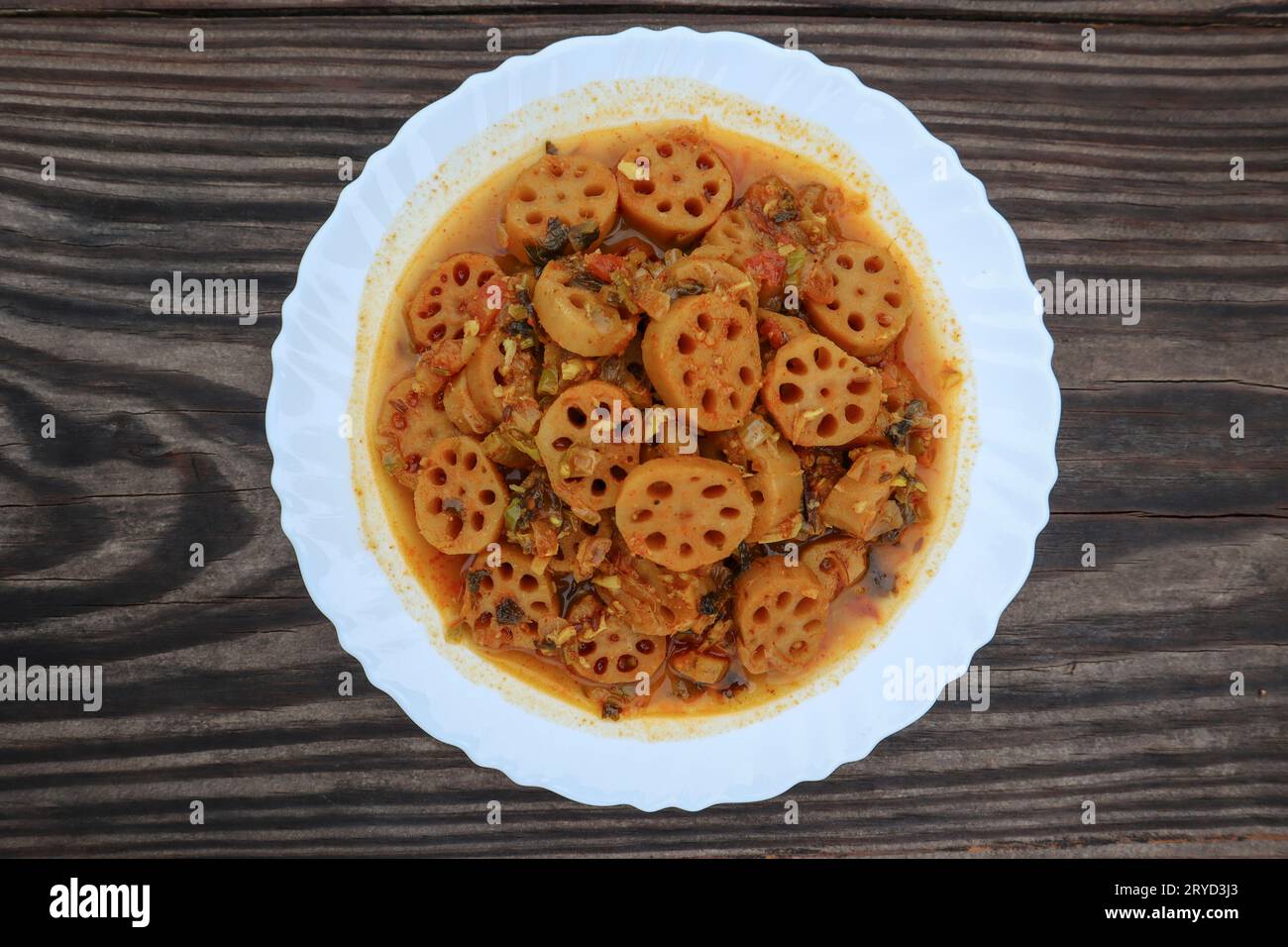 Lotus stem curry dish in hand served. Also called kamal kakadi, nadru ...
