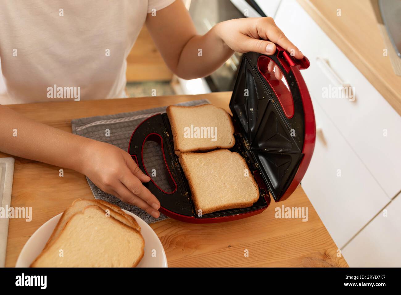 Toaster toast hands hi-res stock photography and images - Alamy