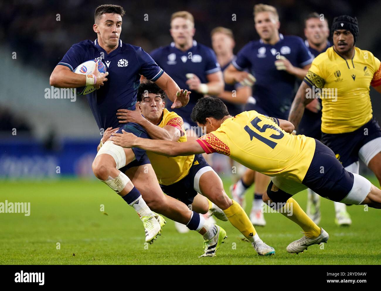 Scotland's Cameron Redpath evades being tackled by Romania's Marius ...