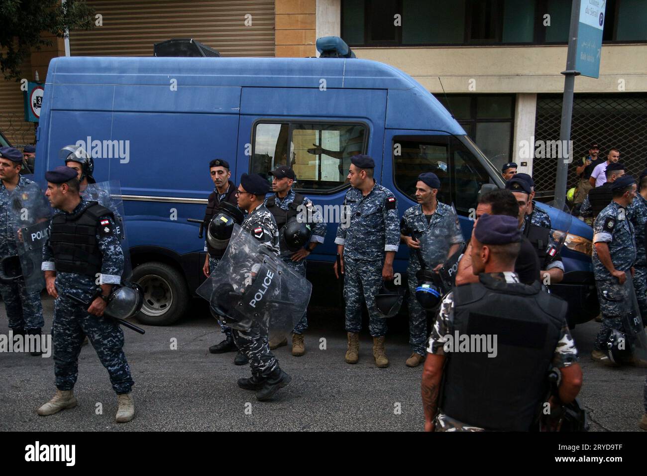 Beirut, Lebanon. 30th Sep, 2023. Riot police secure a van where ...