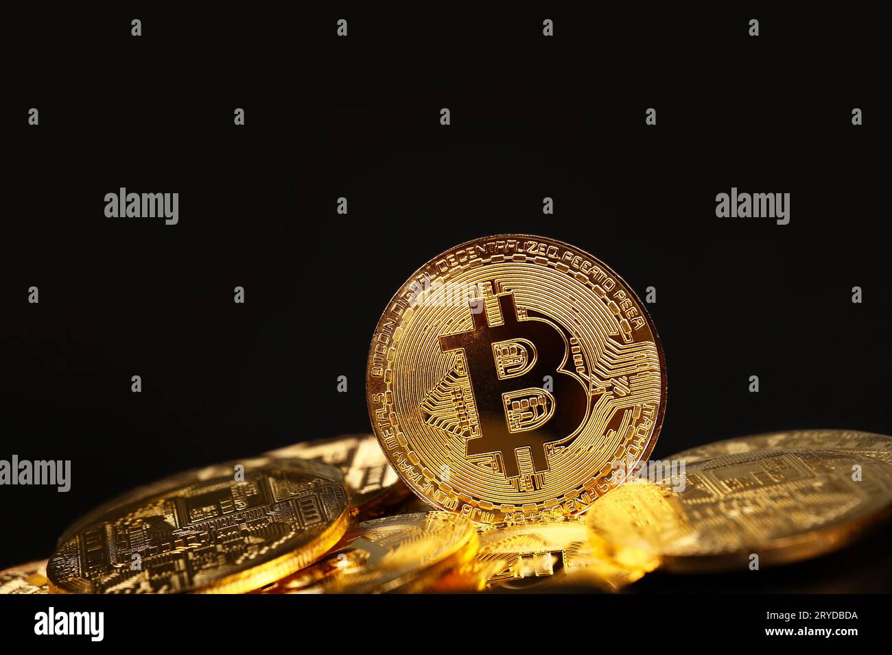 Gold bitcoin physical coins isolated on black Stock Photo - Alamy