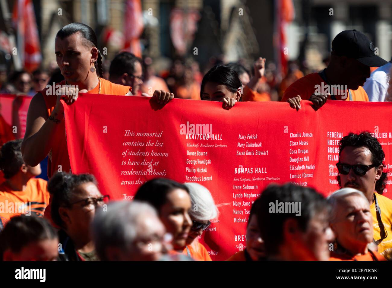 Ottawa, Canada. 30th Sep, 2023. People carry the memorial cloth banner ...