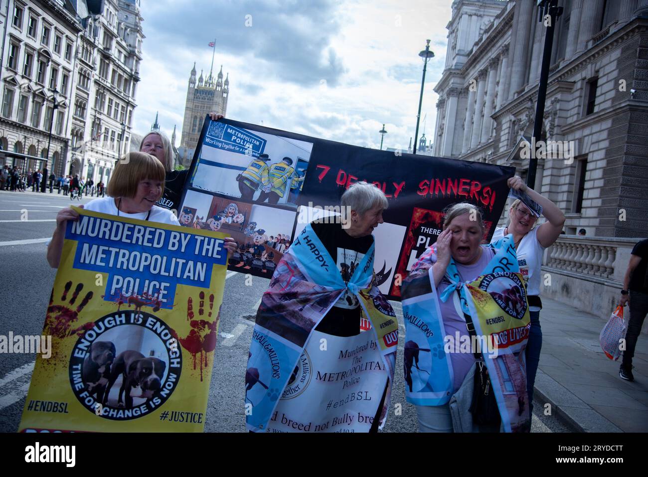 London, UK. 30th Sep, 2023. Protestors march with a placard and banners ...