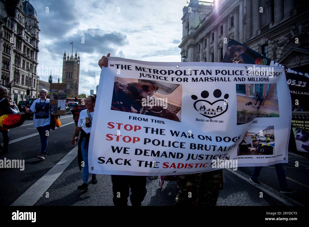 London, UK. 30th Sep, 2023. Protestors march with a large banner during ...