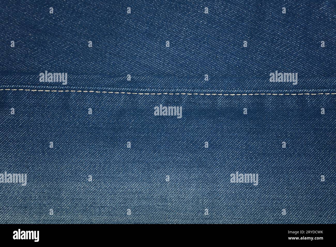 Blue washed jeans denim texture background Stock Photo - Alamy