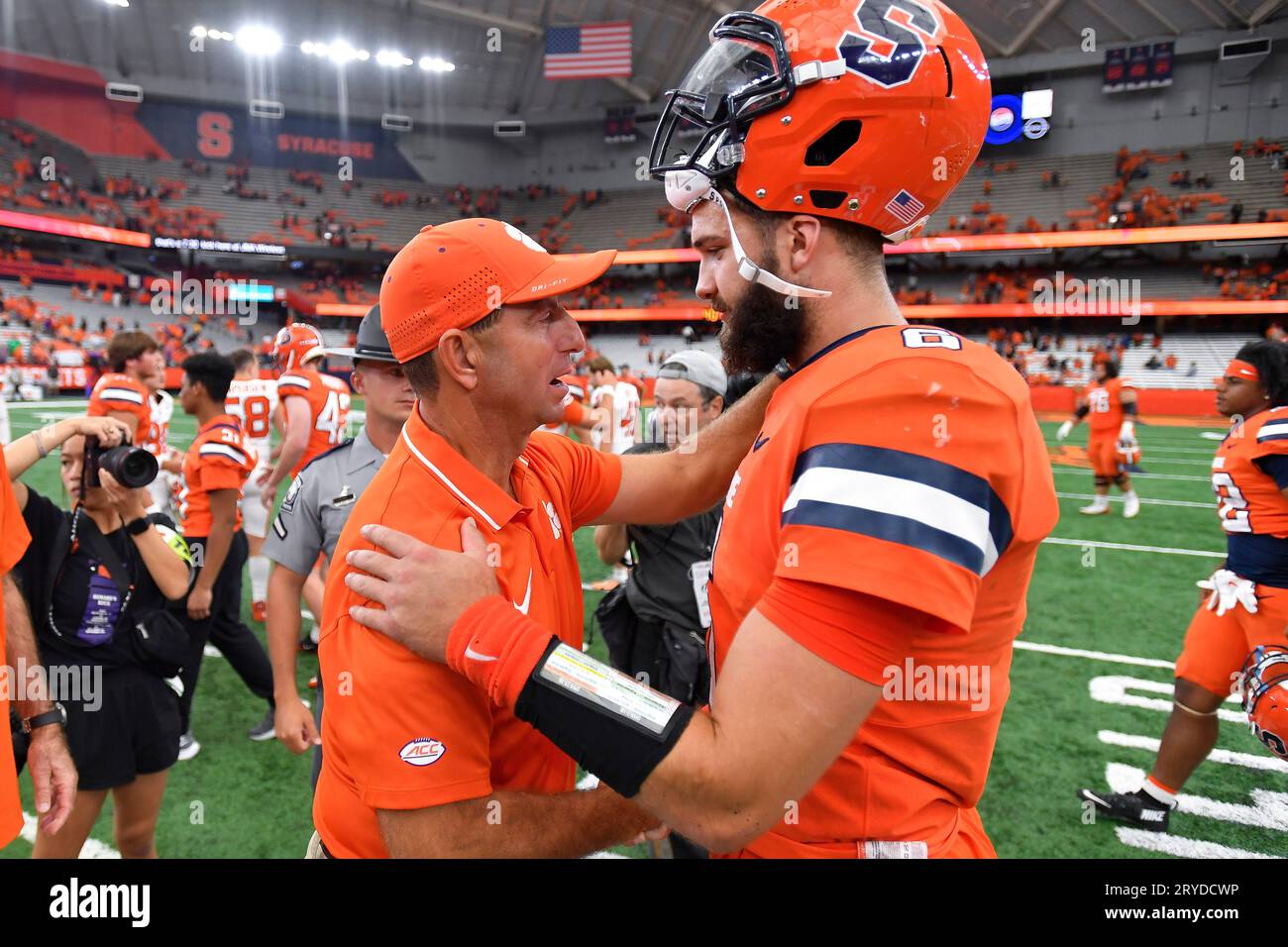 Clemson head coach Dabo Swinney, left, greets Syracuse quarterback ...