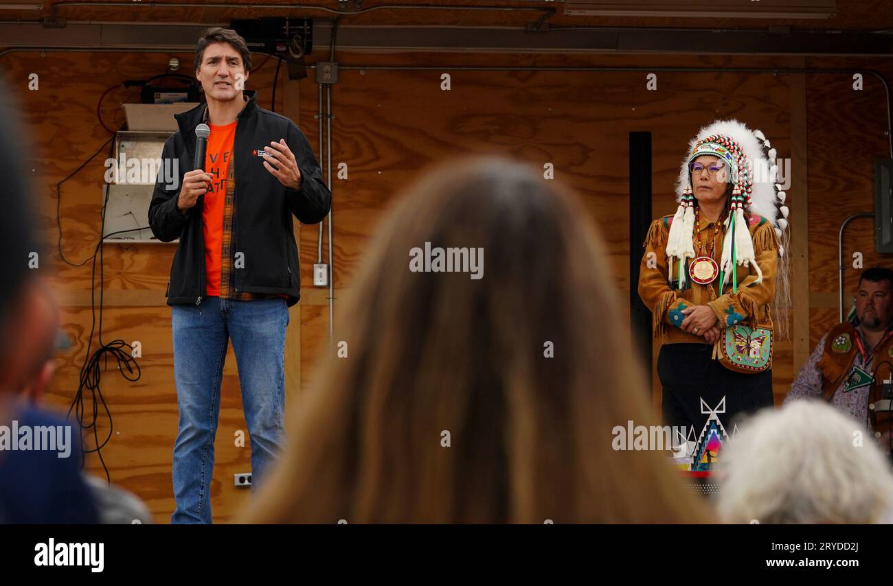 Canada's Prime Minister Justin Trudeau, left, speaks as Lac La Ronge ...