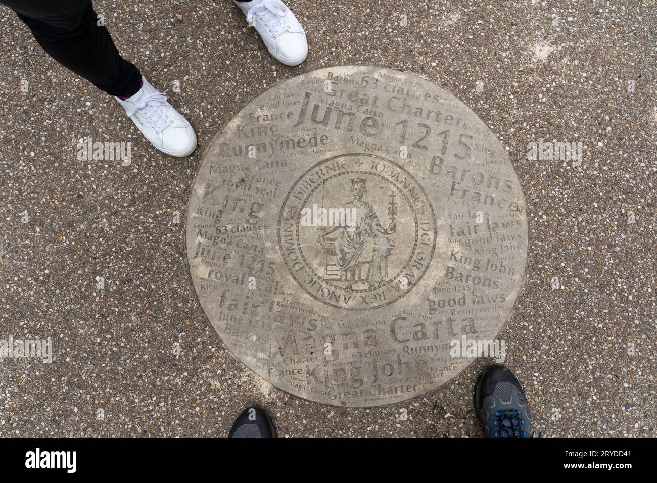 Visitors to Odiham Castle (King John's Castle) standing over a seal ...