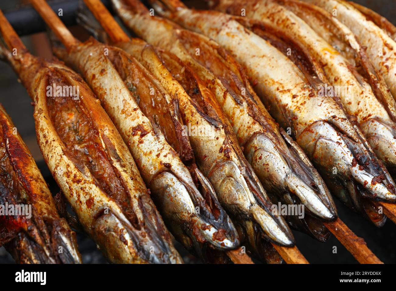 Cooking bonito mackerel fish on grill Stock Photo - Alamy