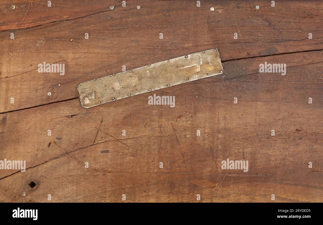 Background texture of brown wood with tin patch Stock Photo - Alamy
