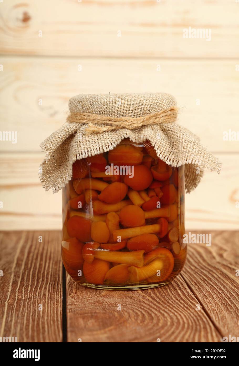 Jar of pickled honey fungus mushrooms on table Stock Photo - Alamy