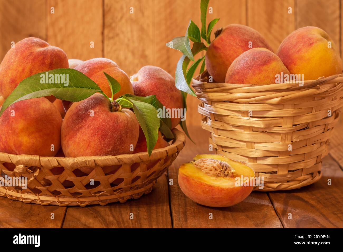 Peaches in a basket Stock Photo - Alamy