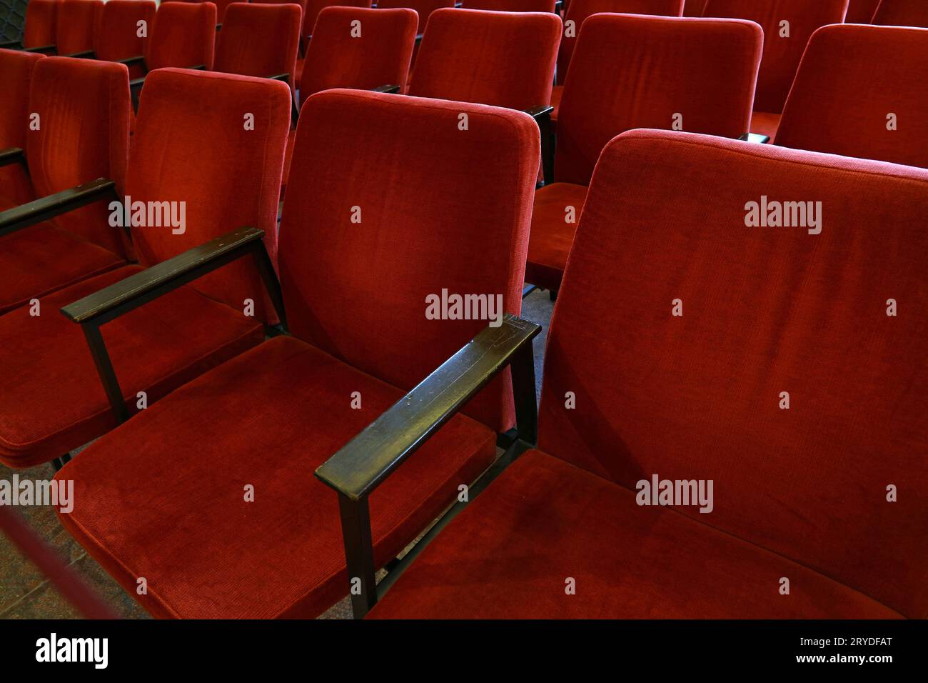 Rows of red soft chair seats close up Stock Photo - Alamy