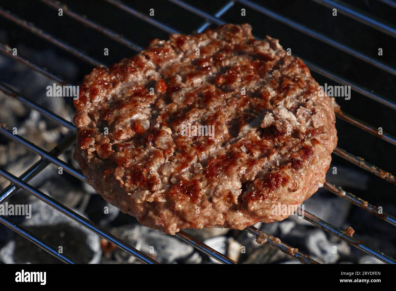 Beef burger for hamburger on barbecue grill Stock Photo - Alamy