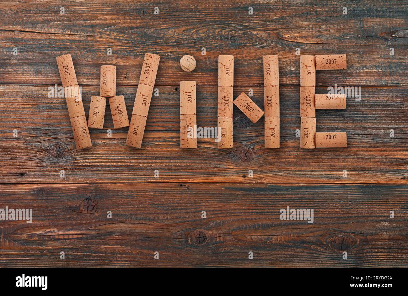 Word wine shaped by corks over dark vintage wood Stock Photo - Alamy