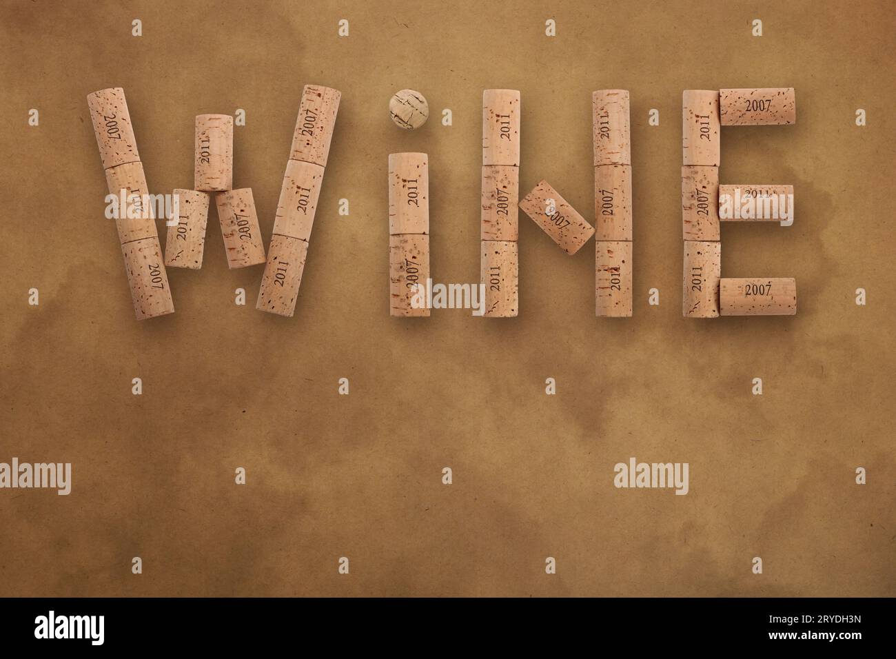 Word wine shaped by corks on brown paper parchment Stock Photo - Alamy