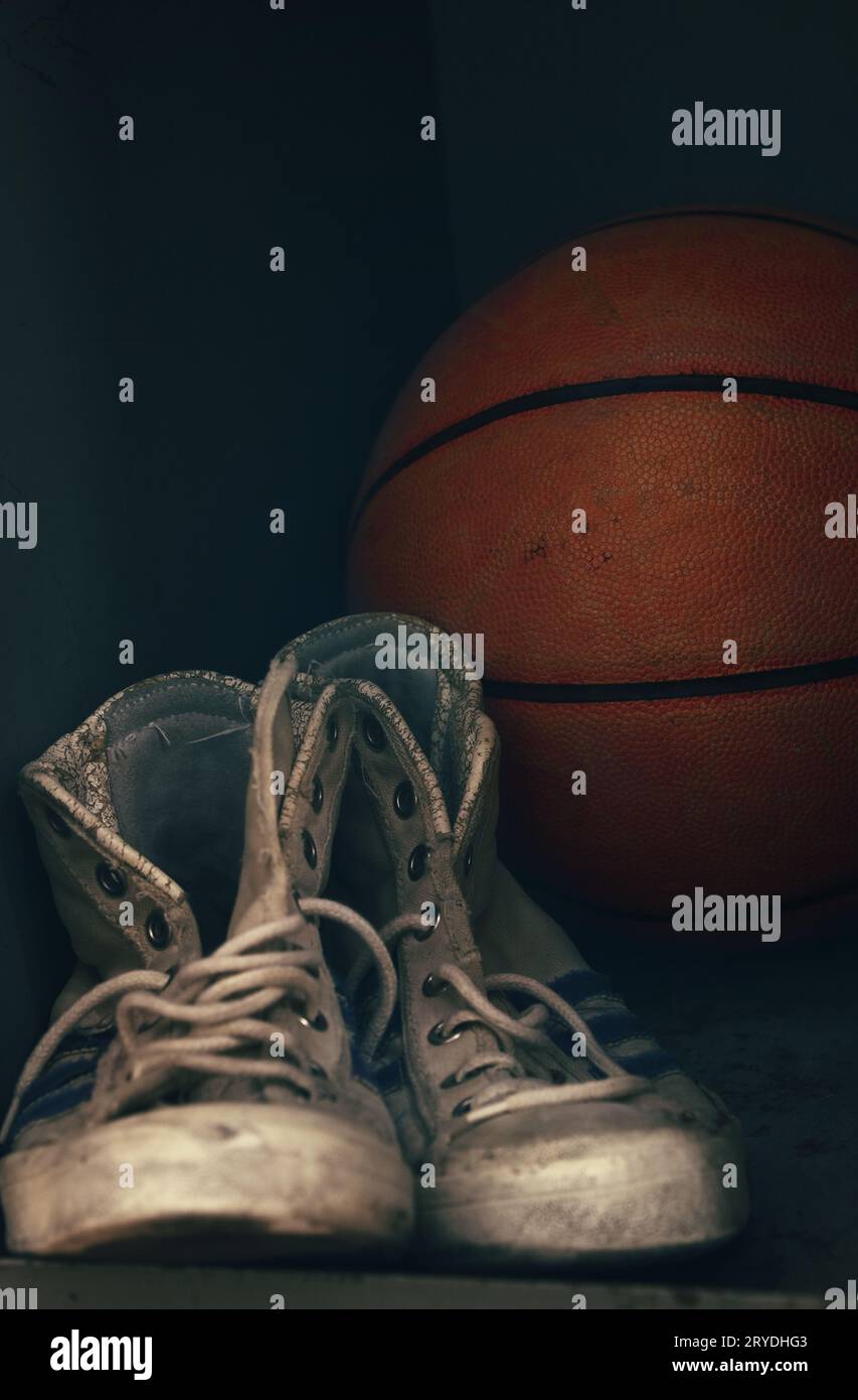 Old sport sneakers shoes and basketball ball Stock Photo - Alamy