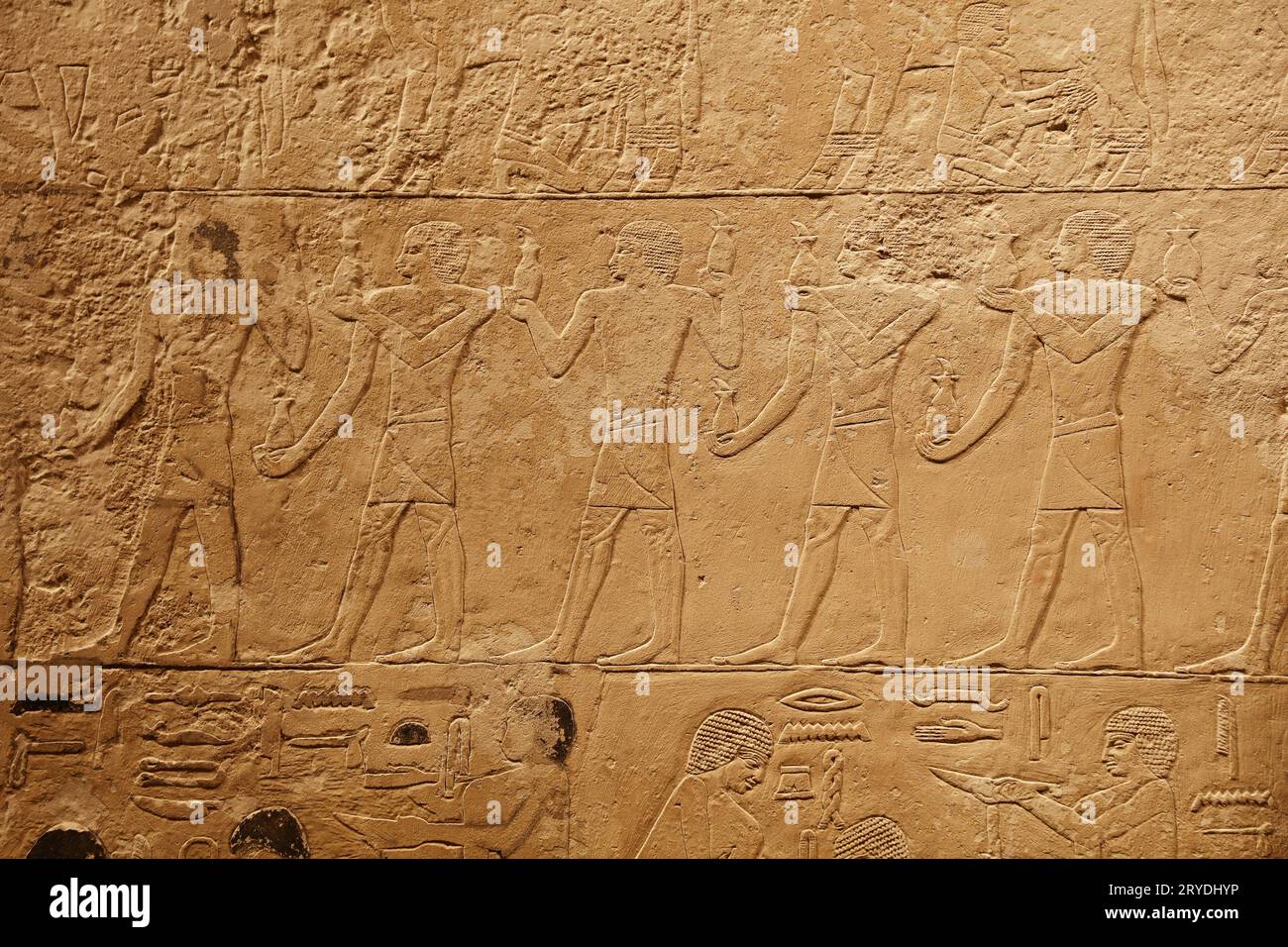 Bas relief with symbols hi-res stock photography and images - Alamy