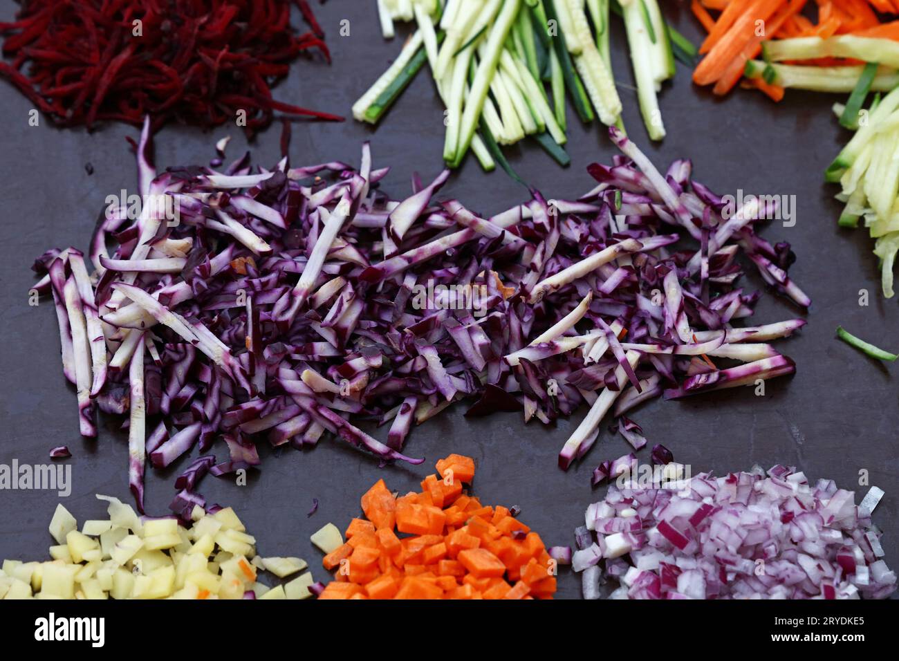 Assorted cut sliced vegetables on cooking board Stock Photo - Alamy