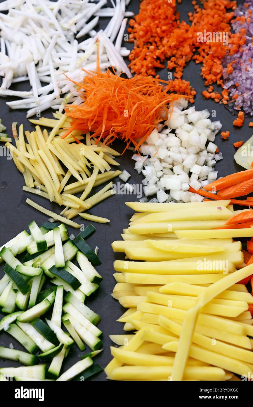 Assorted cut sliced vegetables on cooking board Stock Photo - Alamy