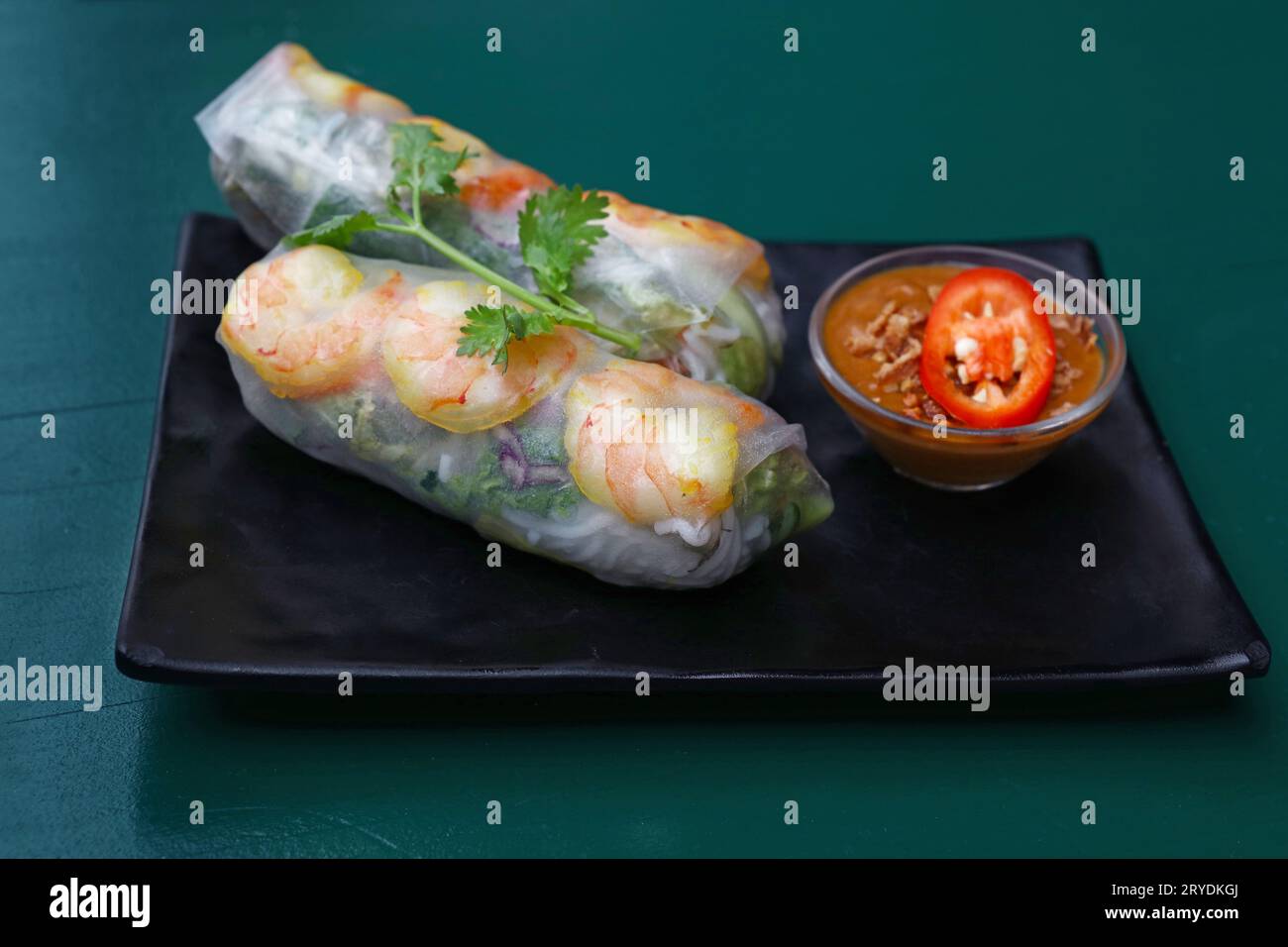 Spring rolls with shrimps and dipping chili sauce Stock Photo - Alamy