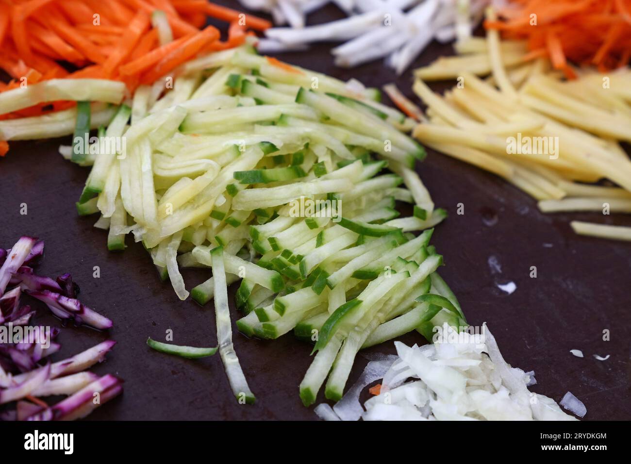 Assorted cut sliced vegetables on cooking board Stock Photo - Alamy