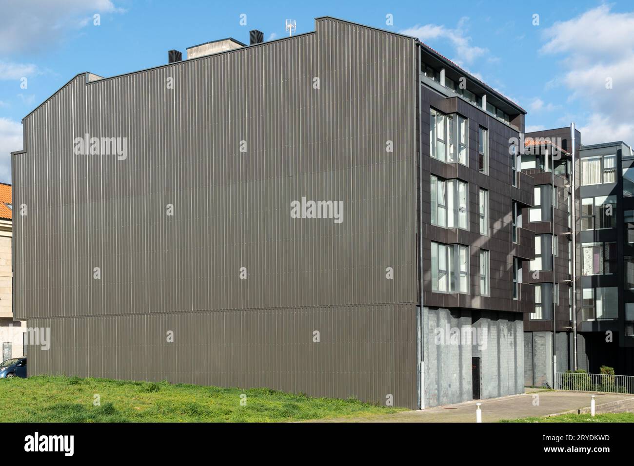 Building facade with metallic cladding Stock Photo - Alamy