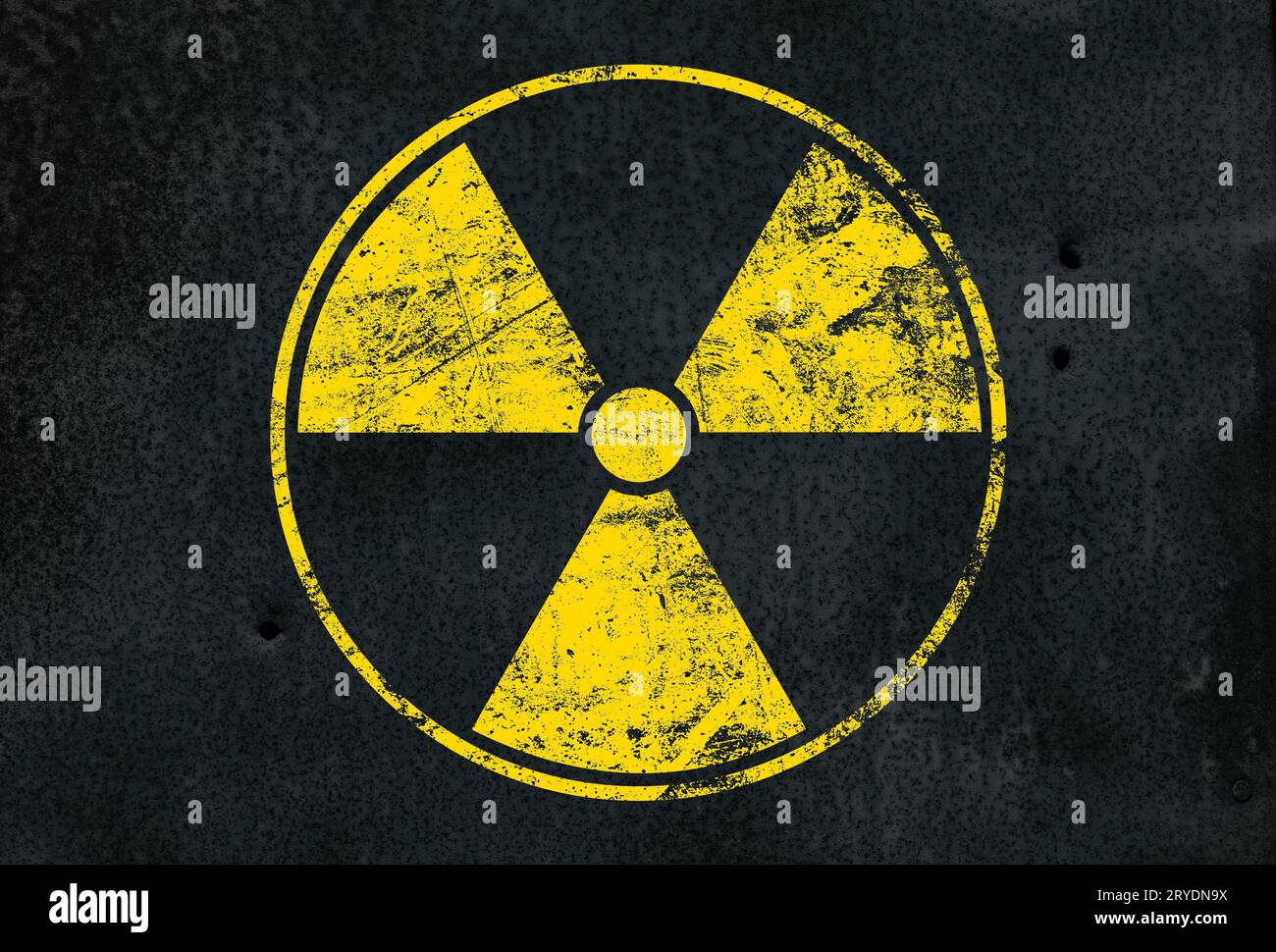 Yellow radioactive sign over black background Stock Photo - Alamy