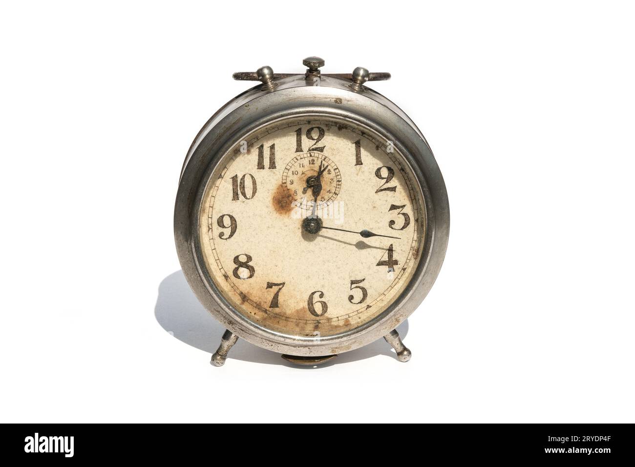 Old alarm clock isolated on white background Stock Photo - Alamy