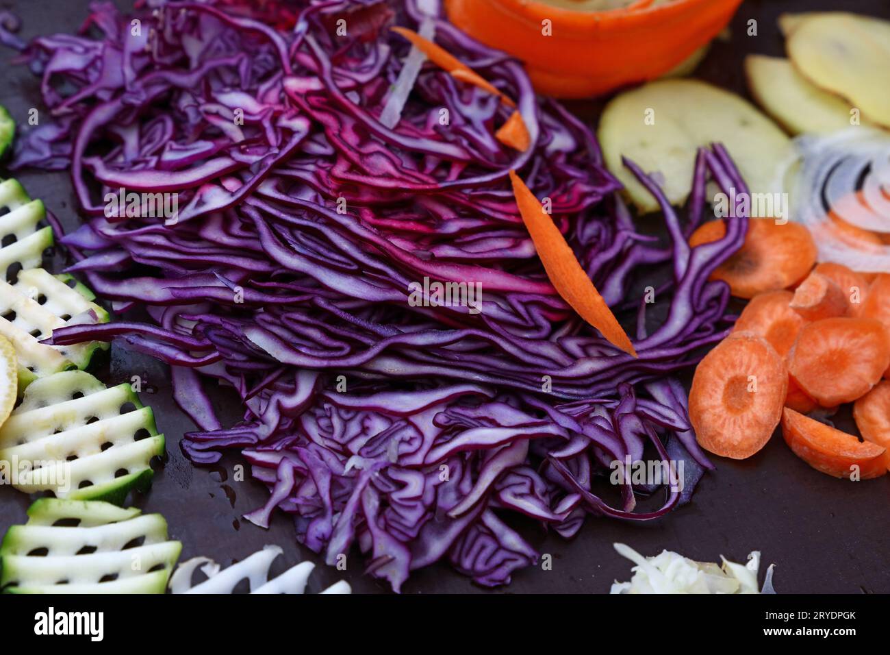 Assorted cut sliced vegetables on cooking board Stock Photo - Alamy
