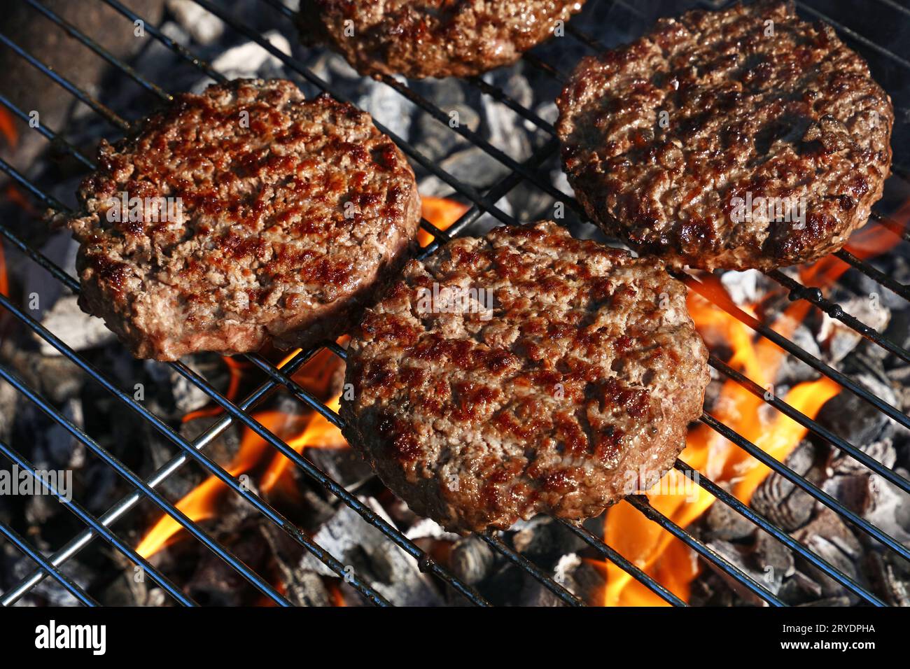 Beef burger for hamburger on barbecue flame grill Stock Photo - Alamy