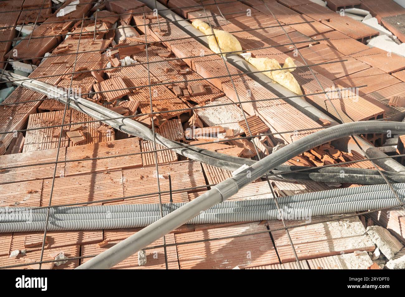 Wire mesh steel and piping for electrical wiring on floor Stock Photo ...