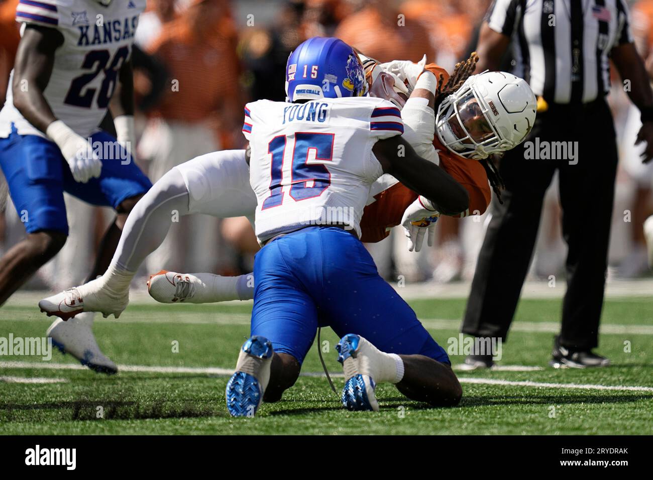 Texas running back Jonathon Brooks (24) is hit by Kansas linebacker ...