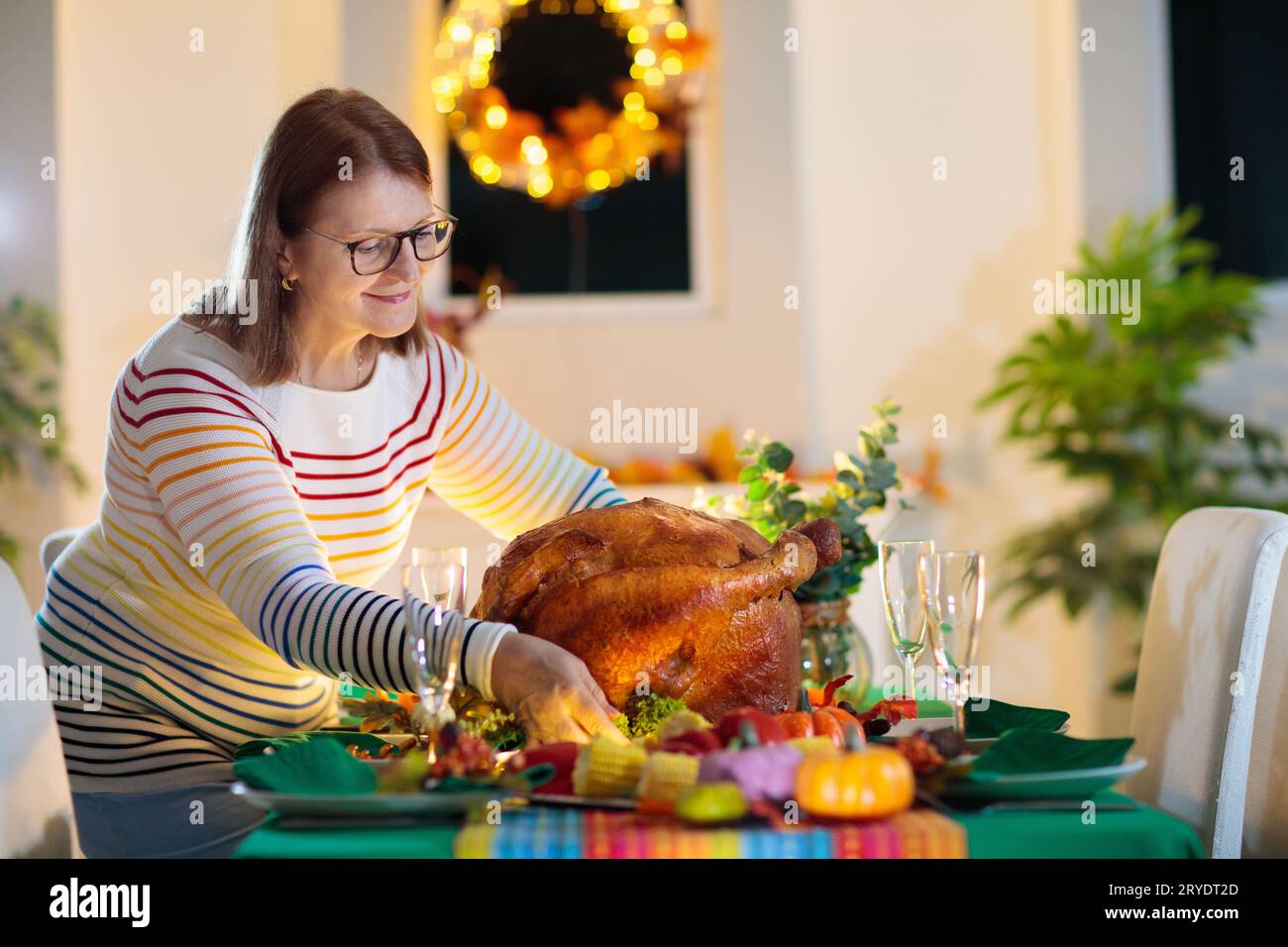 Family at Thanksgiving dinner. Parents, grandparents and kids enjoy ...