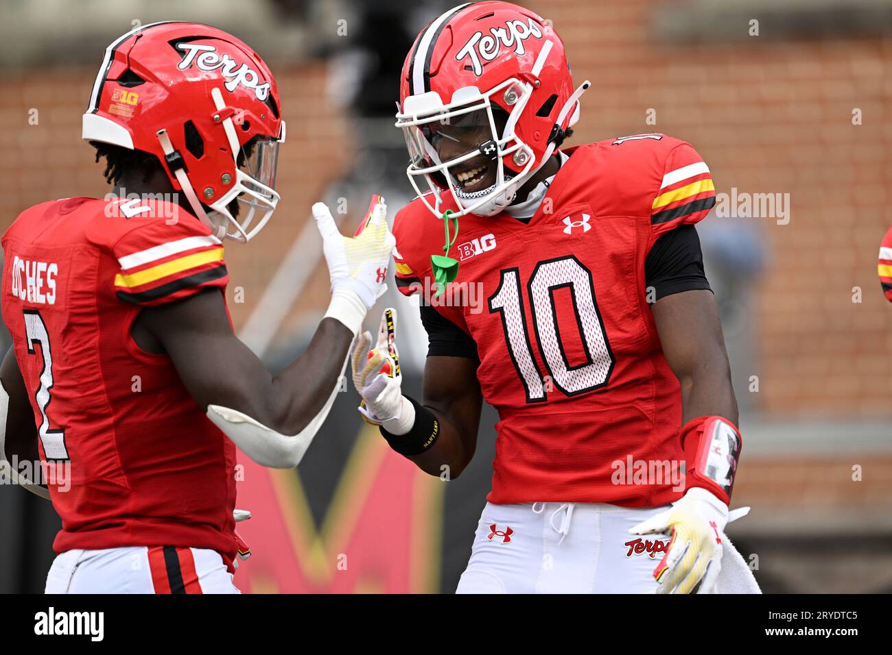 Maryland wide receiver Tai Felton, right, celebrates his touchdown with ...