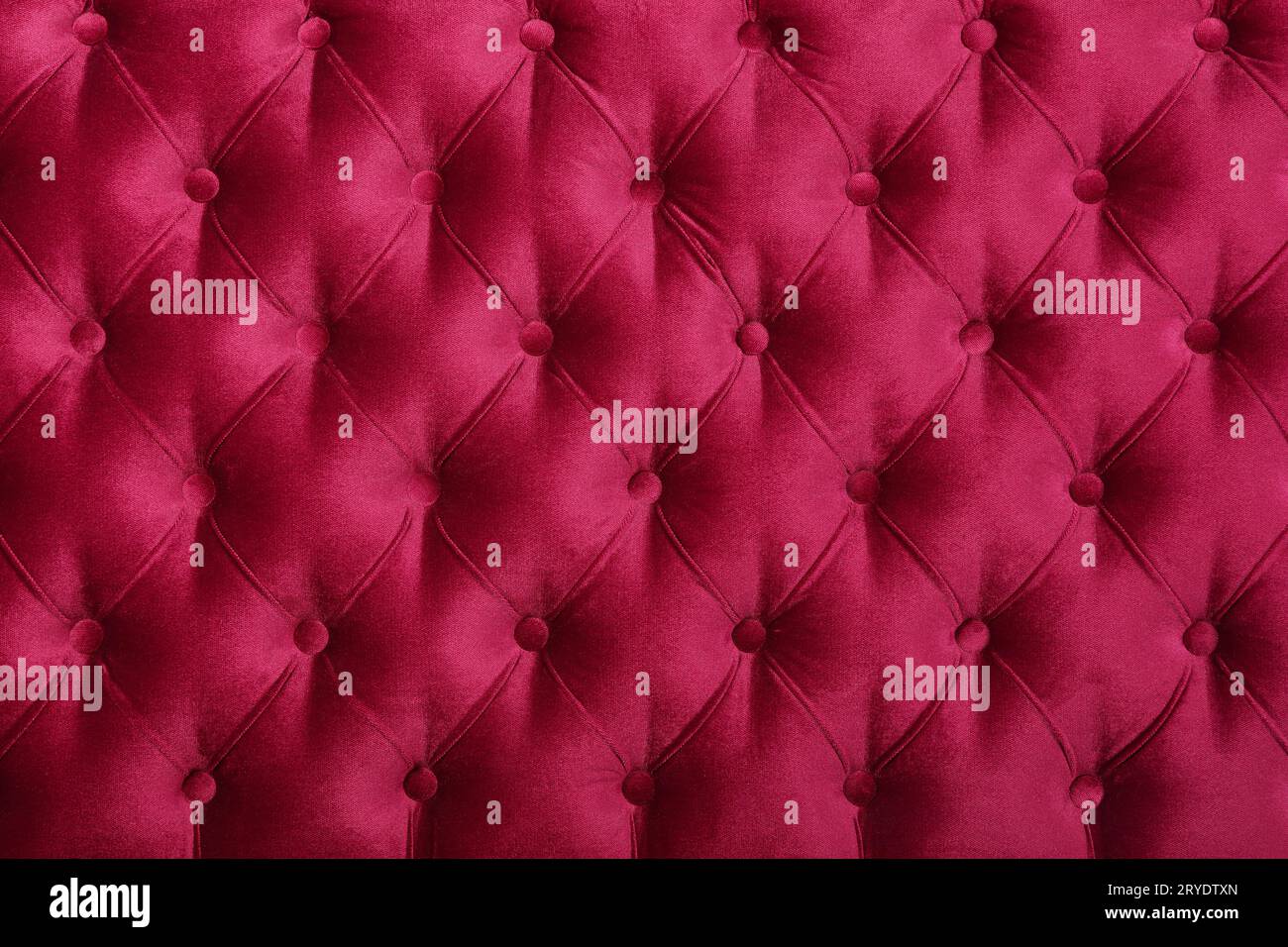 Red capitone tufted fabric upholstery texture Stock Photo - Alamy