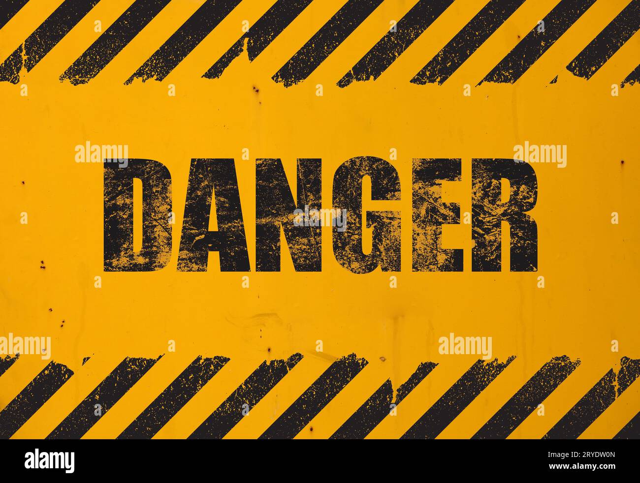 Yellow background with black grunge danger sign Stock Photo - Alamy