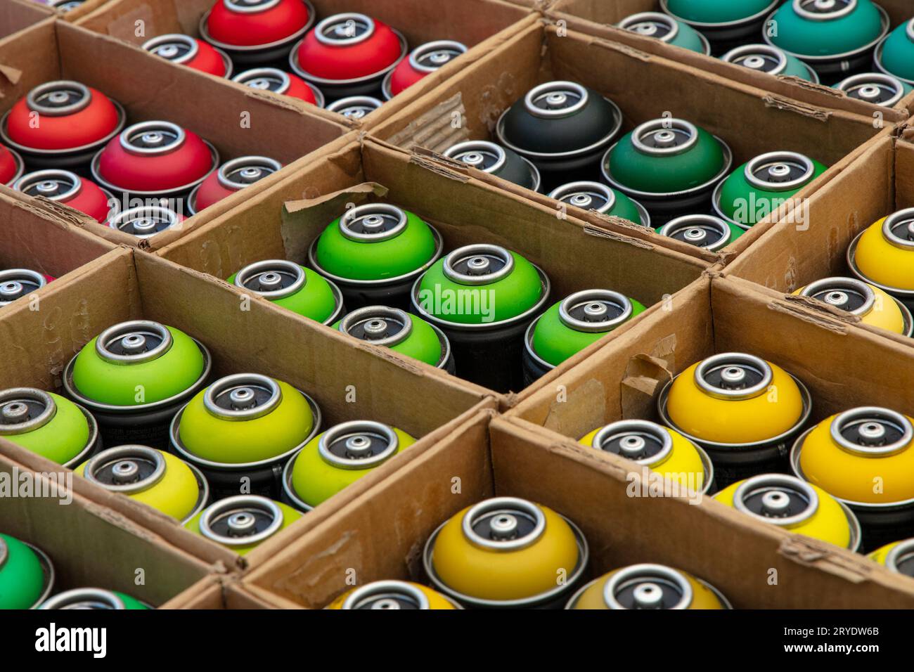 Graffiti spray paint cans in cardboard boxes Stock Photo - Alamy