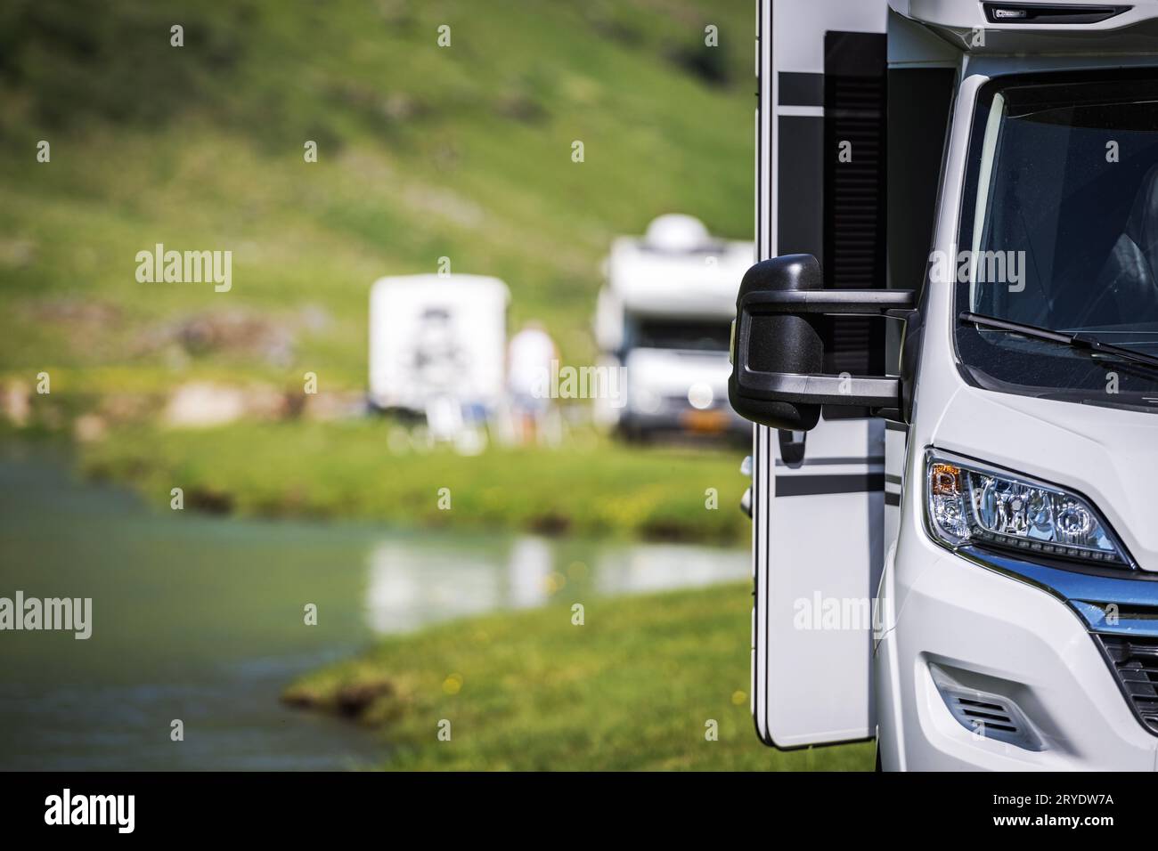 Riverfront RV Camping. Modern Camper Van Road Trip Stock Photo - Alamy